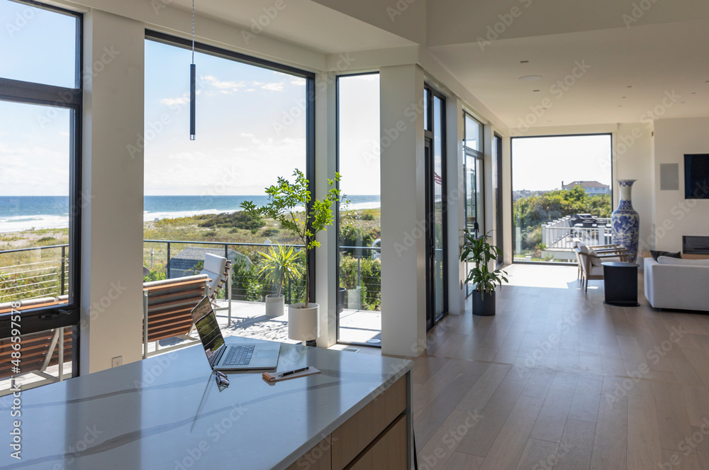 Computer on kitchen island with view to horizon Stock Photo | Adobe Stock