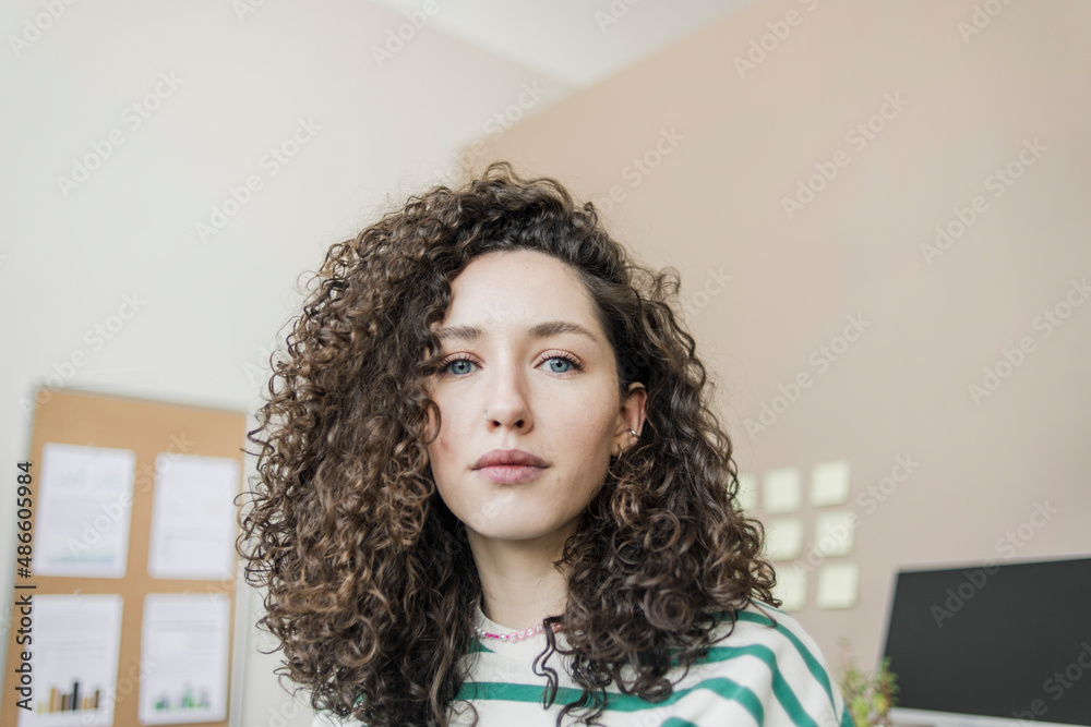 Curly hair business woman in office Stock Photo | Adobe Stock