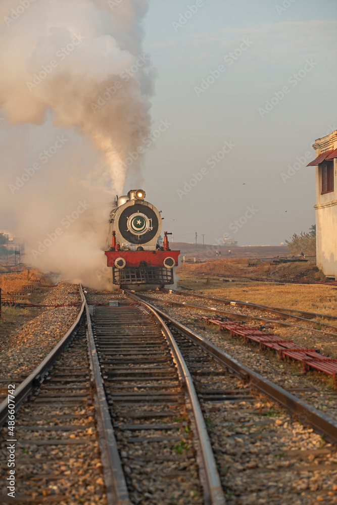 A steam train changing tracks and speeding up over a curve ! Stock ...