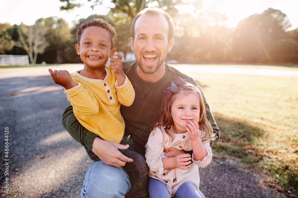 Dad and 2 children Stock Photo | Adobe Stock
