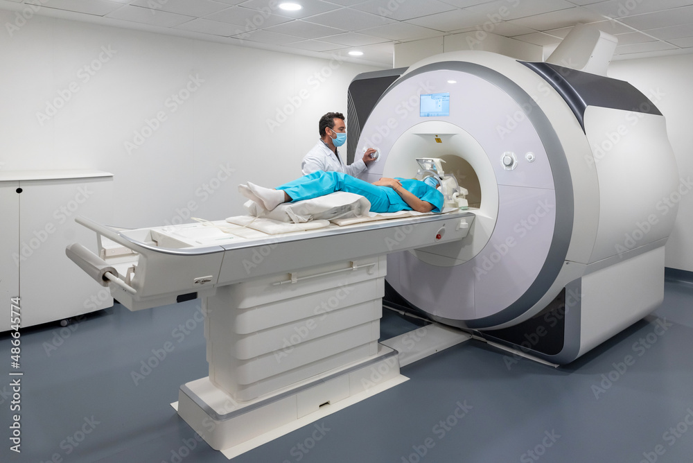 Doctor doing MRI scan for patient Stock Photo | Adobe Stock