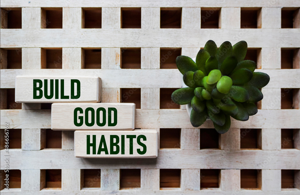 Foto de Symbol of good habits. Wooden blocks with the words build good ...