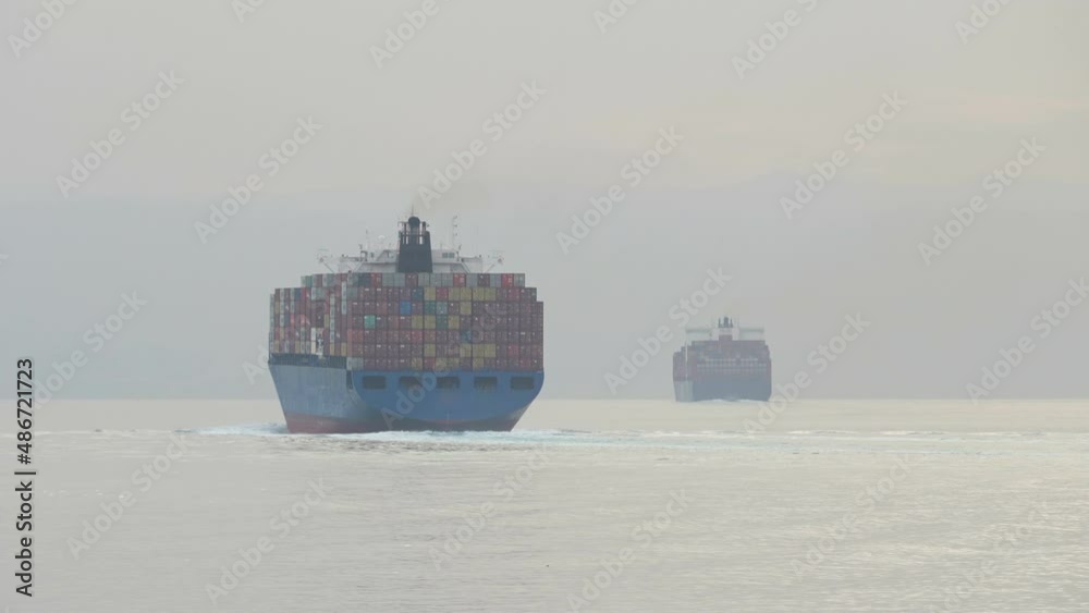 Container ships. Rear view. Vessels float away. A lot of containers on ...