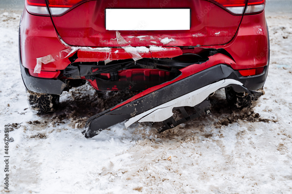 The accident of the red car. The rear bumper of the car cracked fell ...