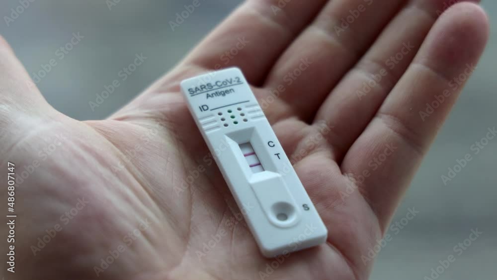 SARS-CoV-2 rapid antigen test with two colored lines - positive result ...