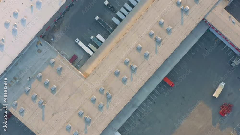 Aerial top down view of warehouses in a logistics park with a sorting ...