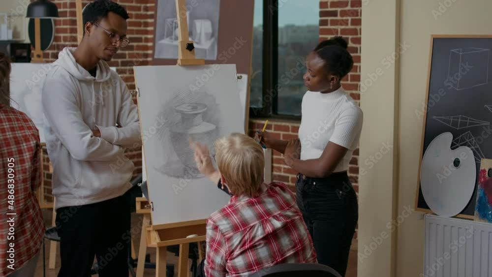 Man and woman guiding elder person to draw vase on canvas, giving ...