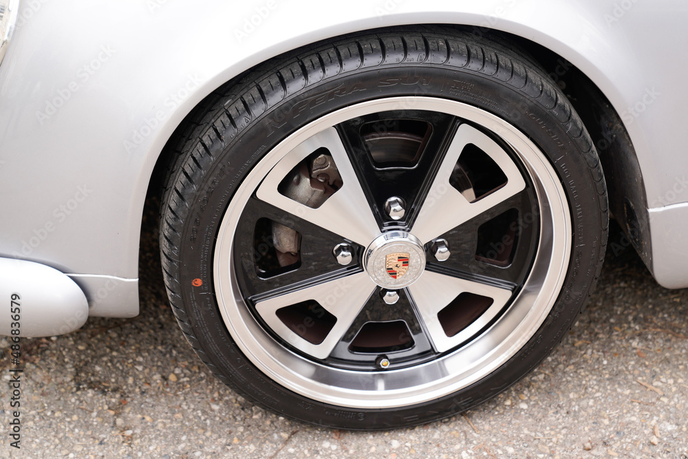 porsche logo sign on front fush wheel and tyre of sport luxury car ...
