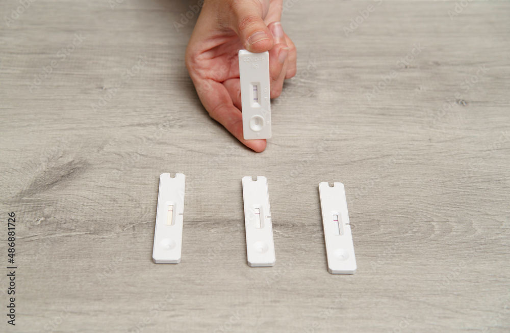 Covid-19 antigen test with negative and positive results Stock Photo ...