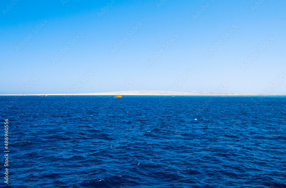 Lonely island in the Red sea. Blue sea water horizon line. Seawater ...