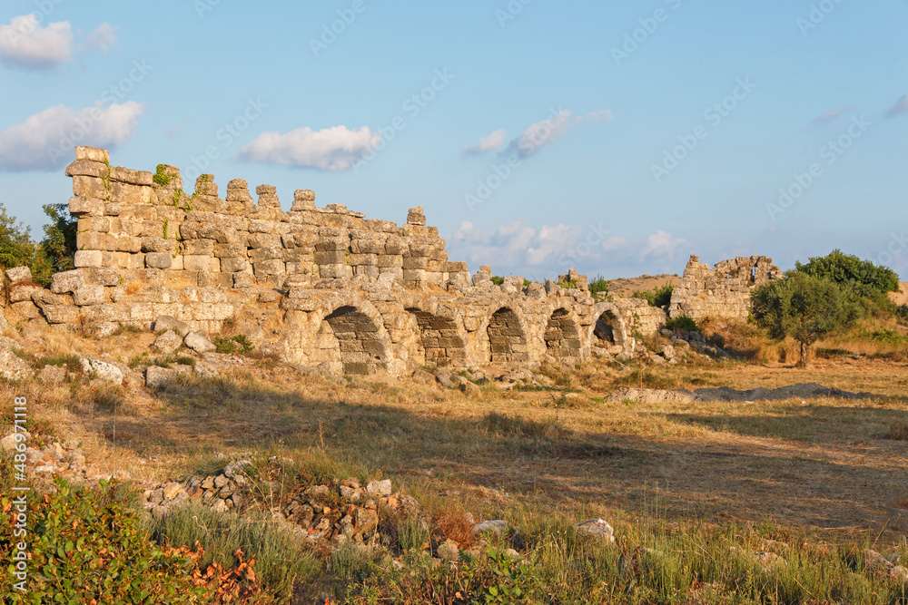 City wall and aqueduc in Side. Ruins of the fortress wall. The ancient ...