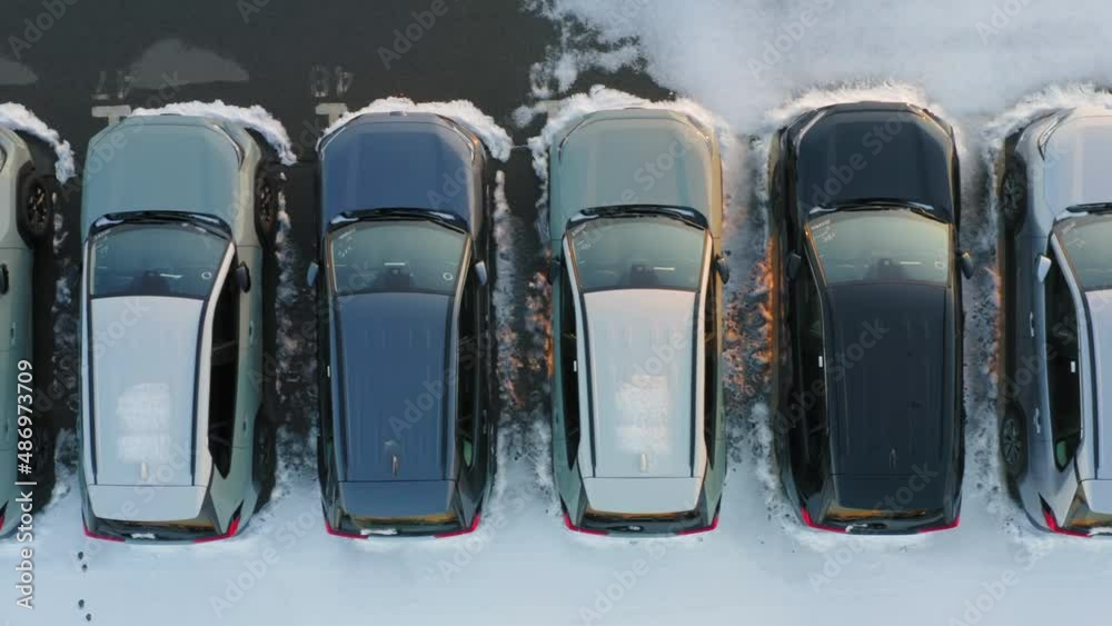 Aerial top down view of the car park of a car dealership or customs ...