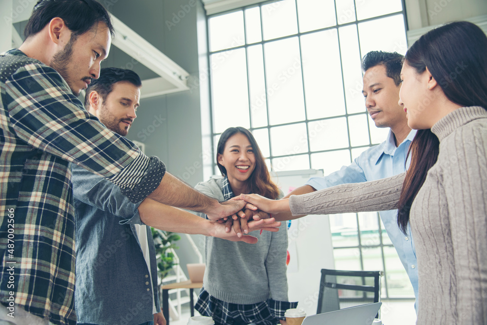 Diversity business partner people teamwork holding hands together power ...