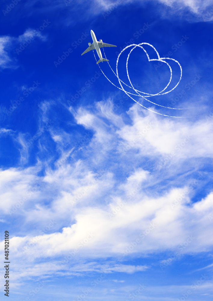 Vertical nature background with aircraft draw a heart in the sky ...