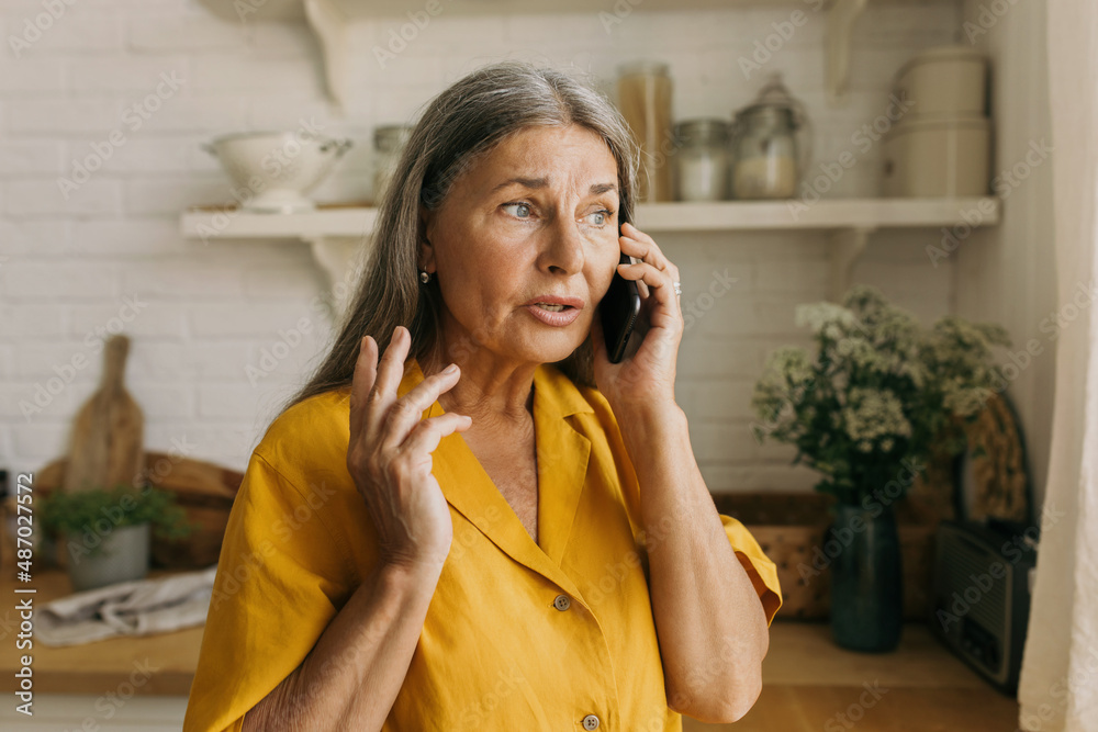 Poster Elderly adorable Caucasian grandmother talking on phone with her ...