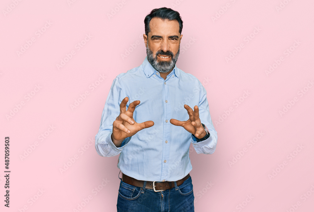 Middle aged man with beard wearing business shirt disgusted expression ...