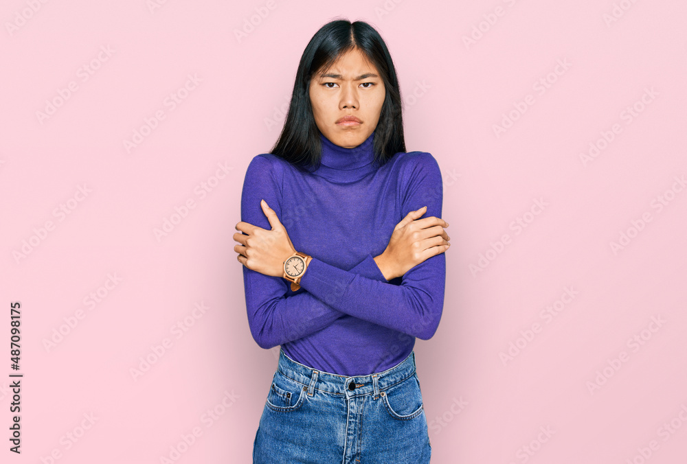 Beautiful young asian woman wearing casual clothes shaking and freezing ...