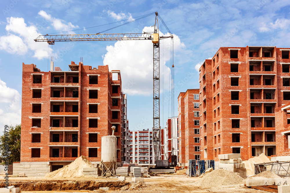 Construction Site of Brick Houses. High rise buildings under ...