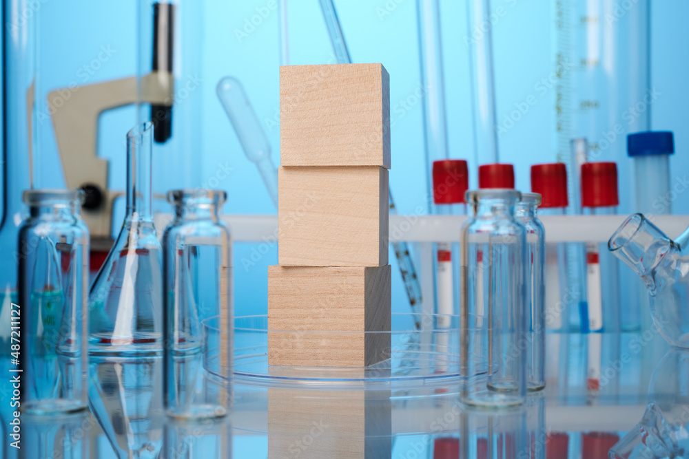 3 wooden cubes on a chemical desk - labs photo. Clean wood modules with ...