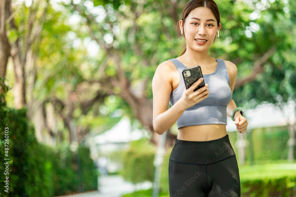 Running Asian woman. Female Runner Jogging during Outdoor Workout in a ...