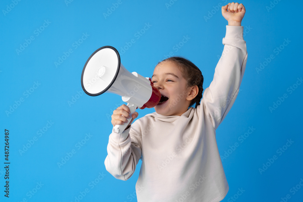 Child girl using megaphone against blue background Stock Photo | Adobe ...