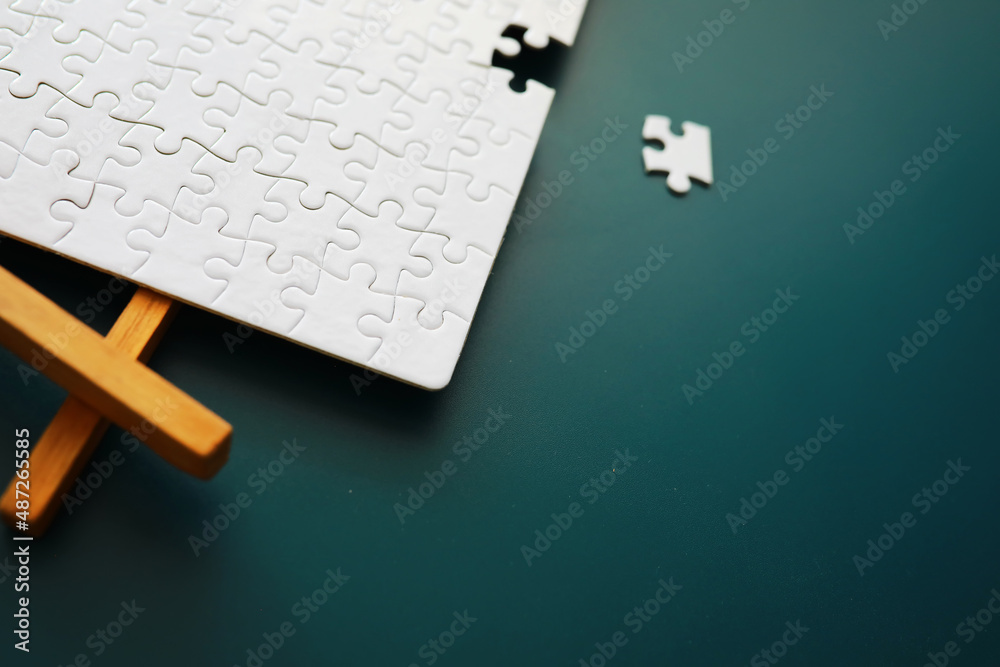 Intellectual puzzles. The puzzle is empty. The hand puts together ...