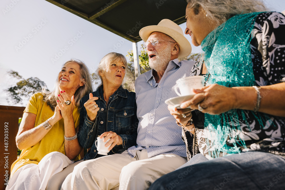 Old time friends laughing together over tea Stock-Foto | Adobe Stock