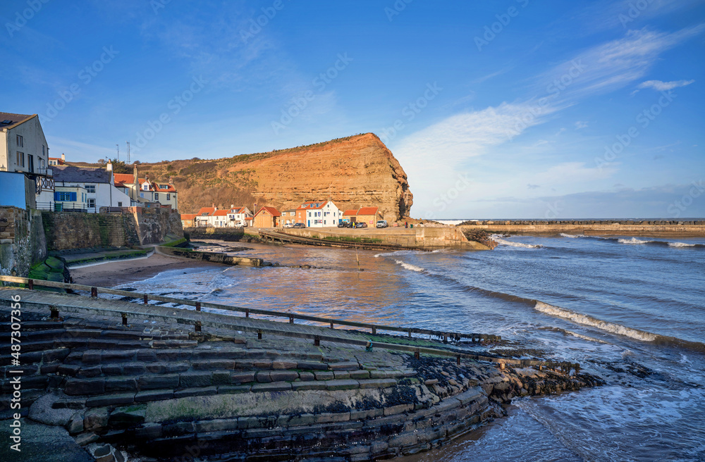 Staithes seaside town and sea defenses in North Yorkshire Stock Photo ...