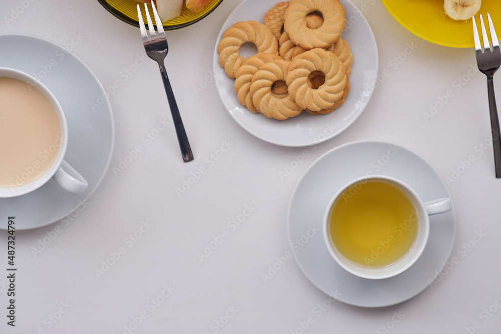 Top down view of cup of tea on a table with biscuits Stock Photo ...