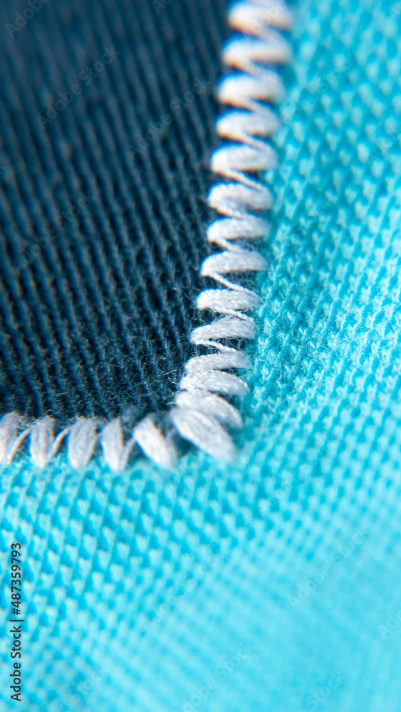 Parche azul cosido con hilo blanco en tejido azul turquesa Stock Photo ...