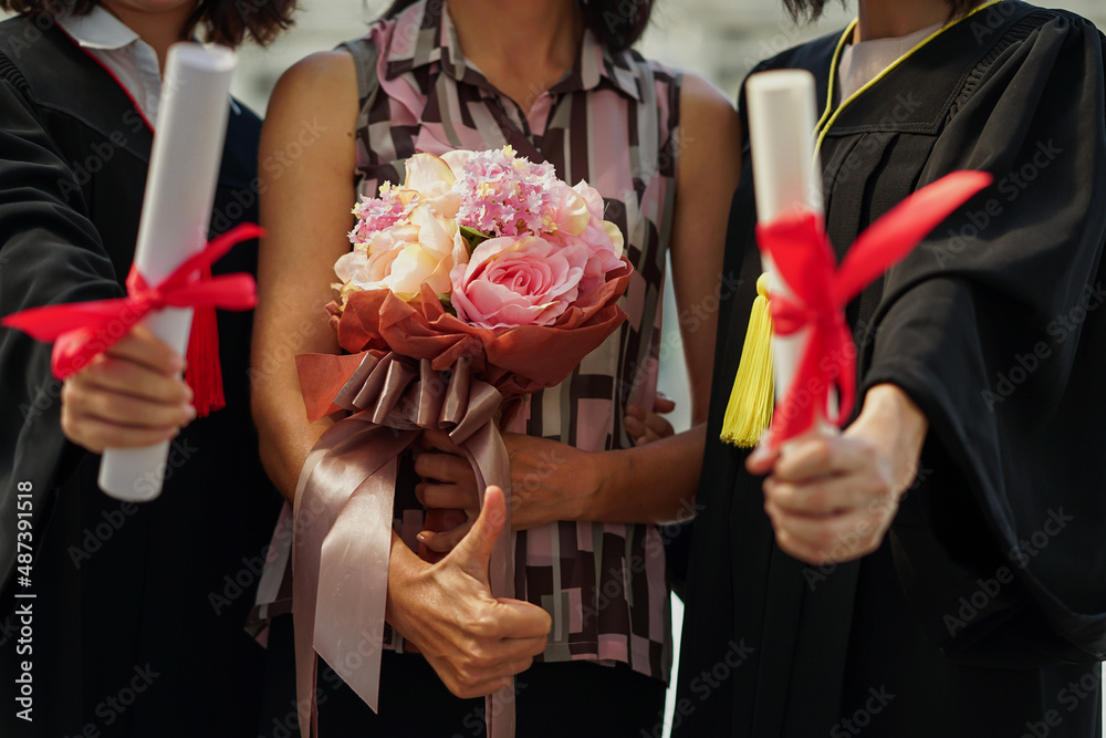 graduation day happy family with girl hold diploma and balloon ...