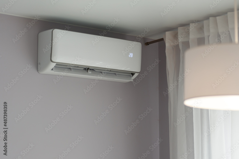 Split system of air conditioner or heat pump operating in home interior ...
