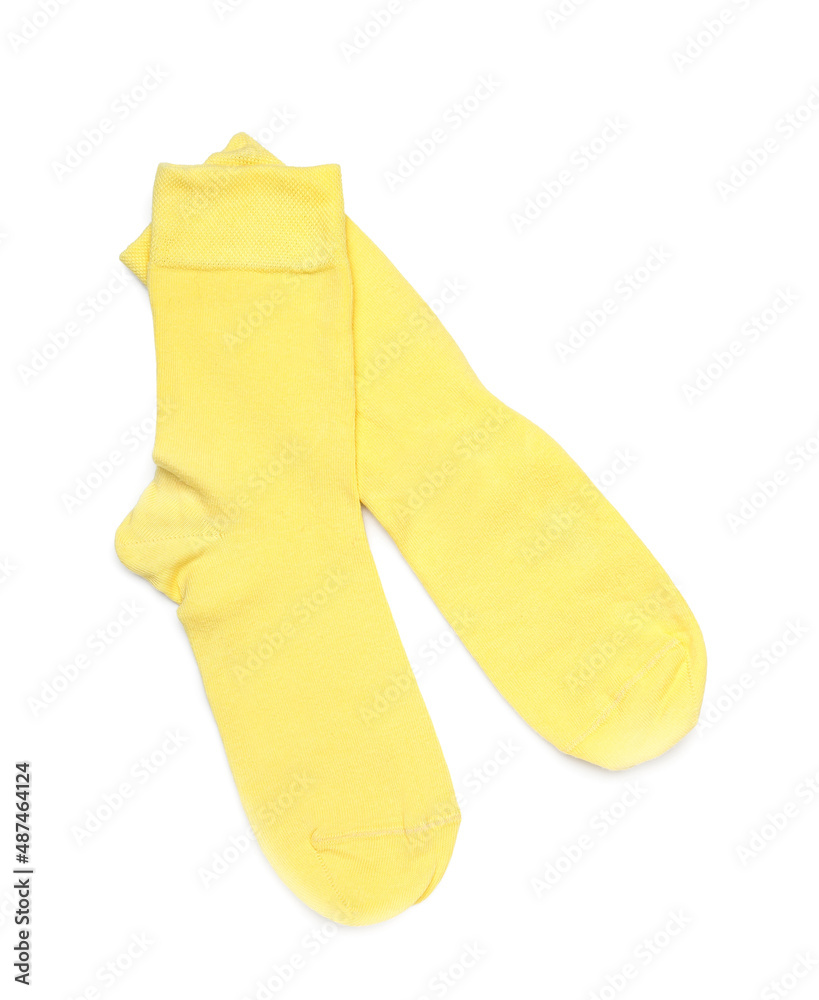 Pair of yellow socks on white background Stock Photo | Adobe Stock