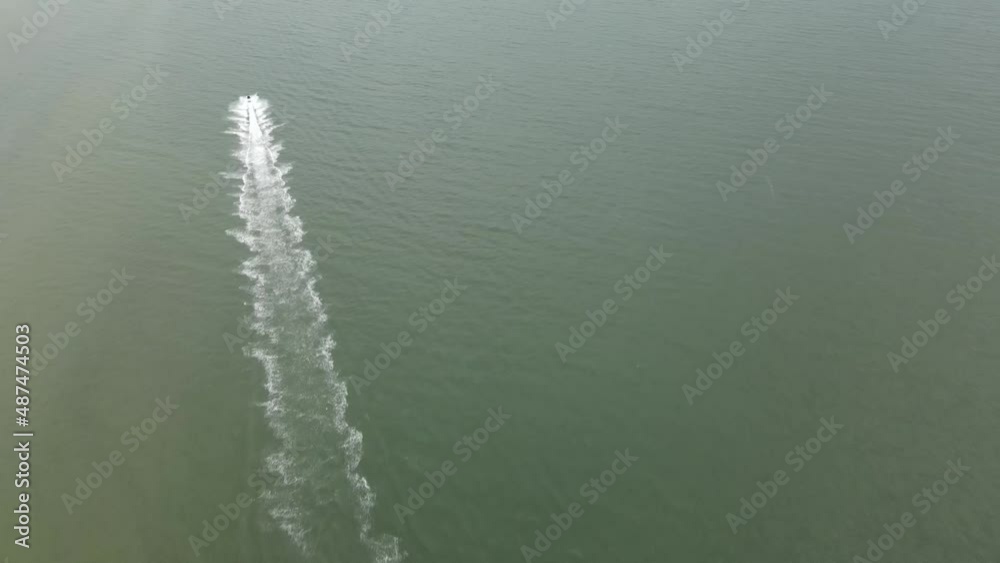 Top view speedboats are sail on the surface of the clear sea. Waves ...