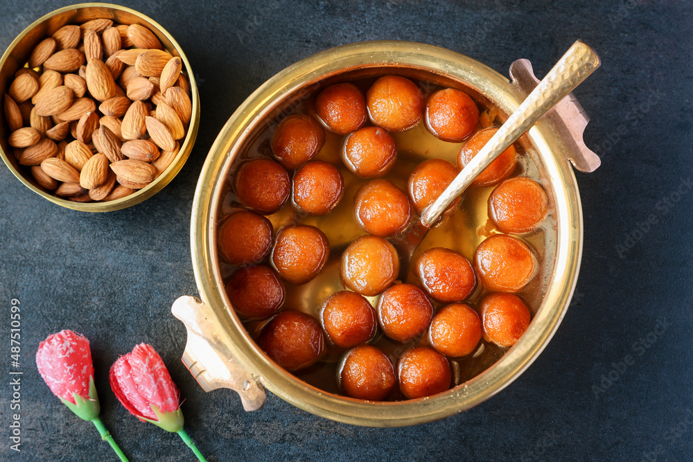 Gulab jamun gulaab jamun sugar syrup golden bowl Indian sweet food ...