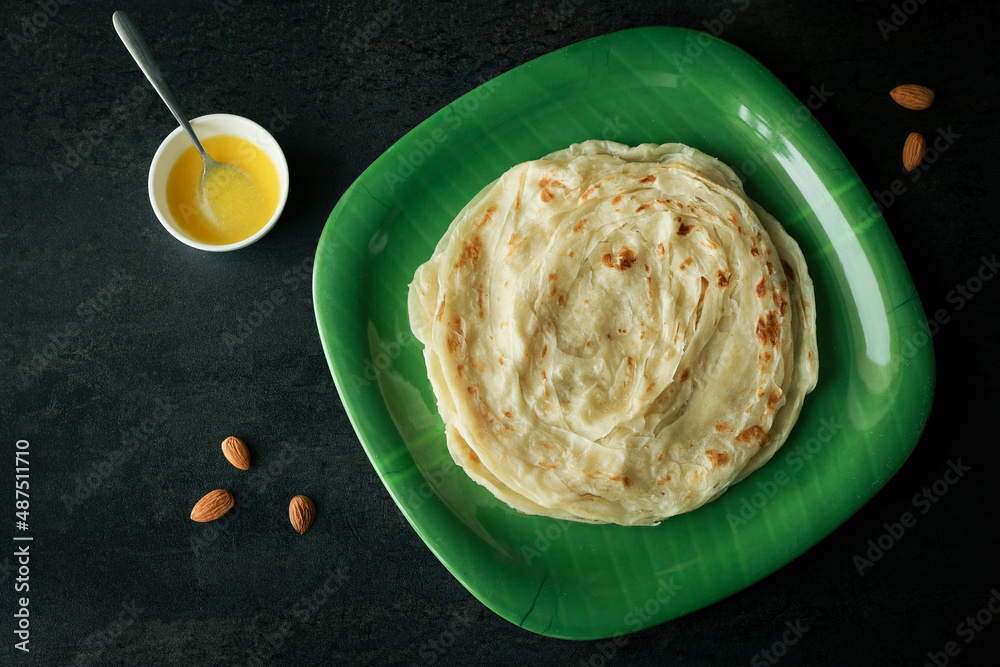 Kerala paratha porotta ghee meat curry roti Malabar parotta barotta is ...