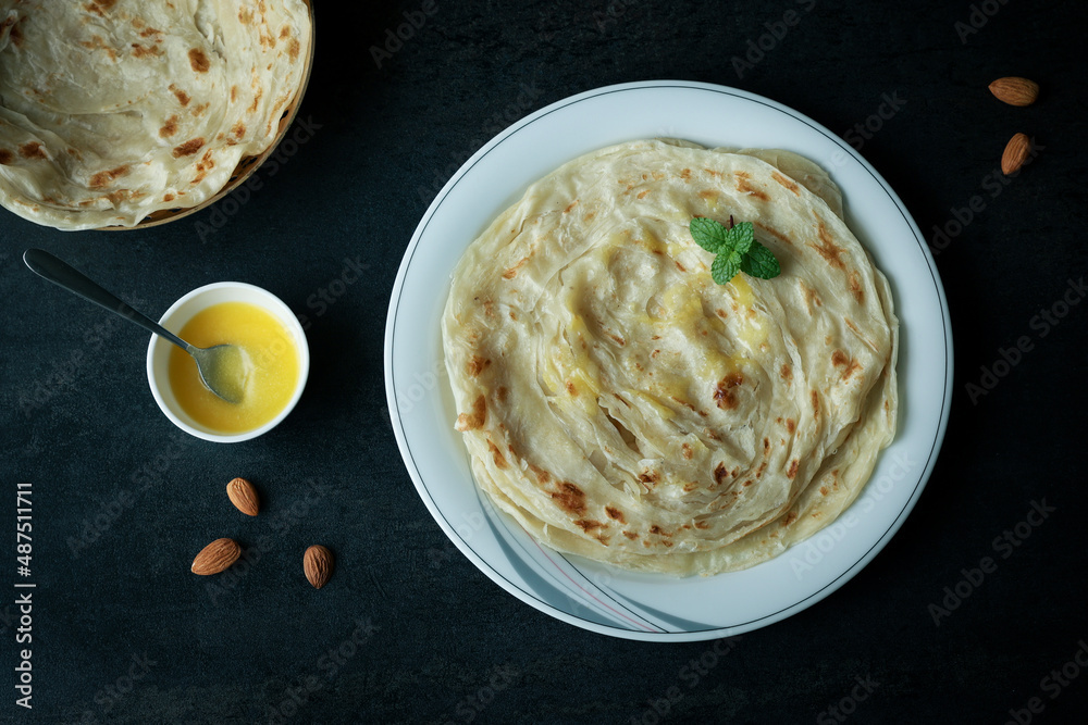 Kerala paratha porotta ghee meat curry roti Malabar parotta barotta is ...