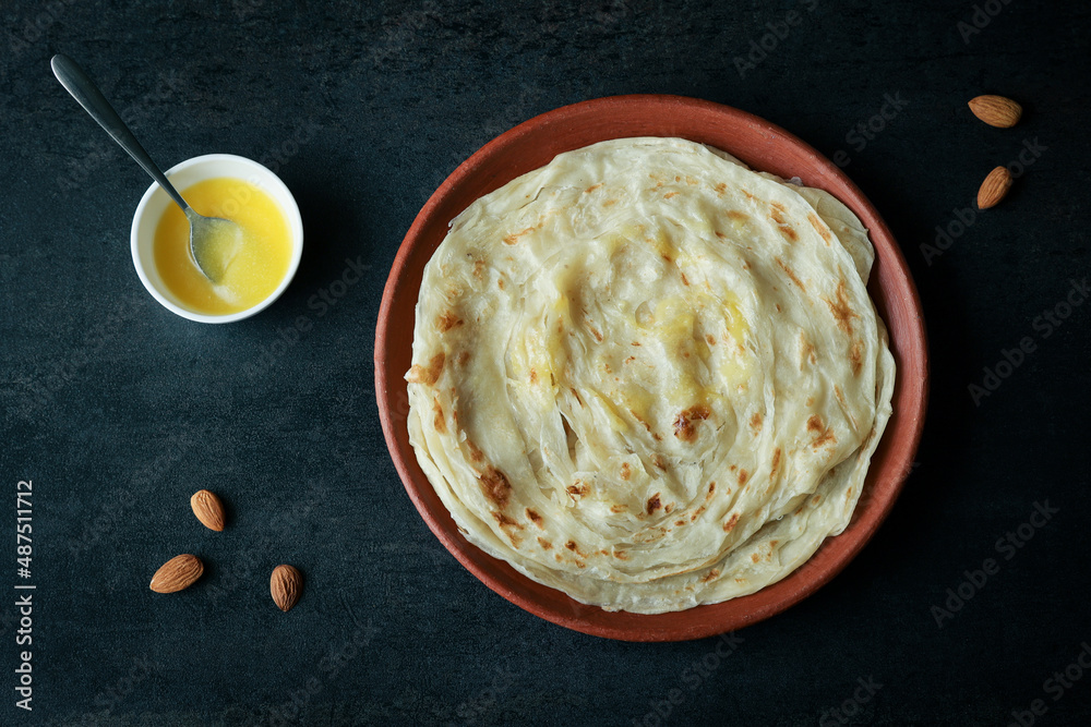 Kerala paratha porotta ghee meat curry roti Malabar parotta barotta is ...