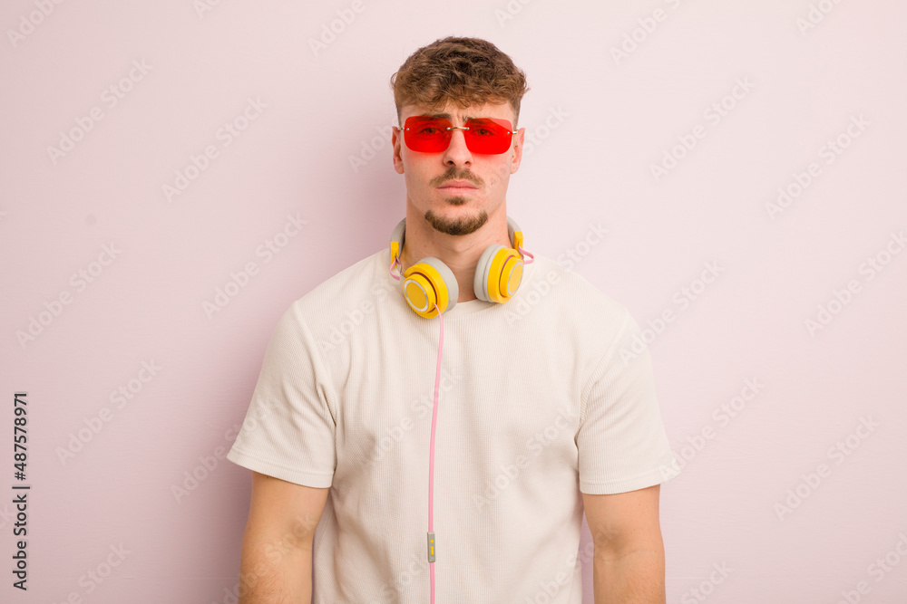 young cool man feeling sad and whiney with an unhappy look and crying ...