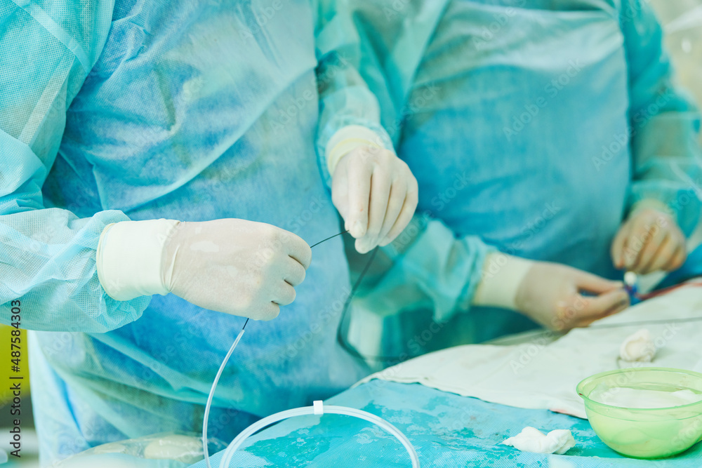 Interventional radiology. surgeon radiologist at operation during ...