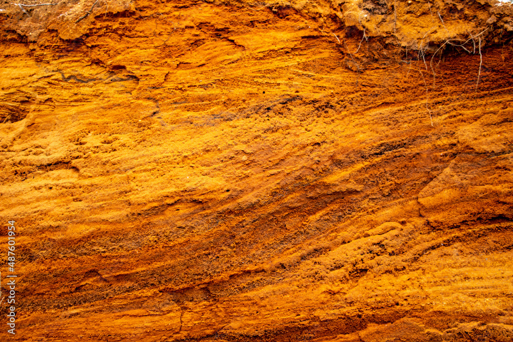 Textural sand, with relief surface, multi-colored layers and different ...