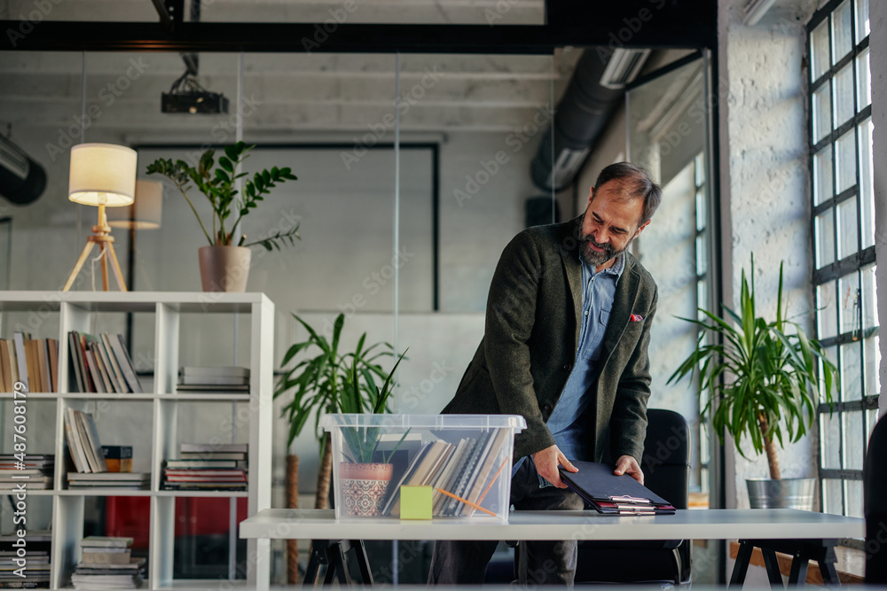 Taking stuff out of box for setting up office table Stock Photo | Adobe ...