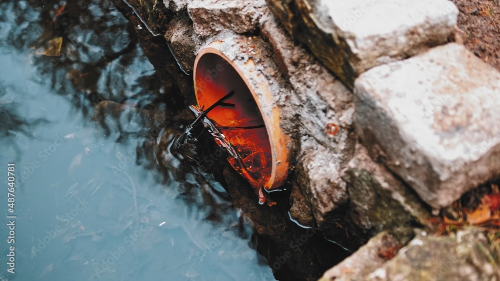 Clean Water Stream Flowing Through Culvert PVC Pipe in Brick Wall ...