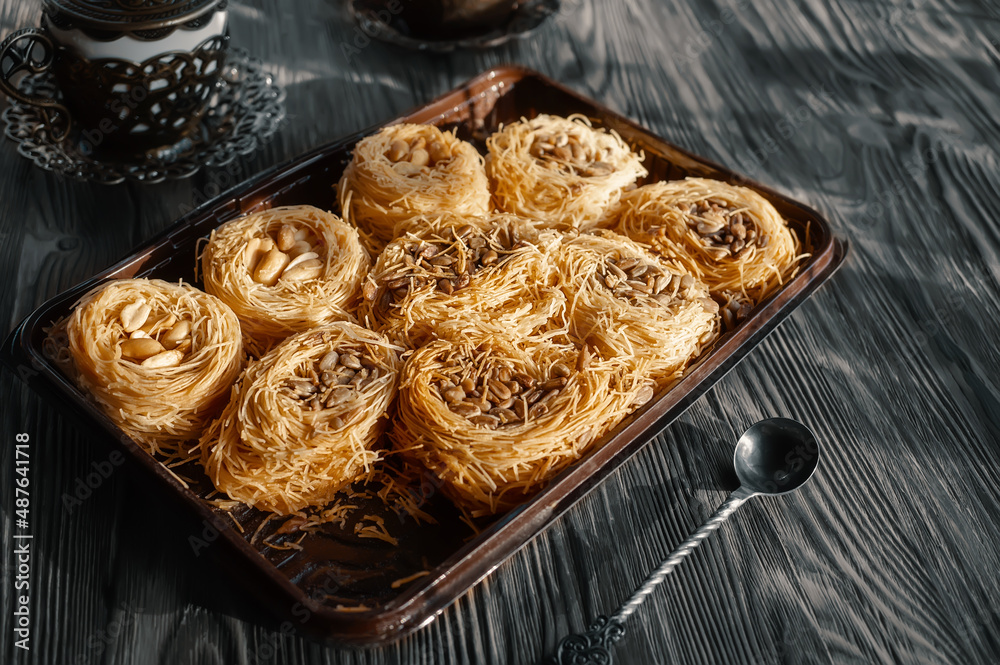 Baklava dessert with roasted peanuts from crushed filo dough in the ...