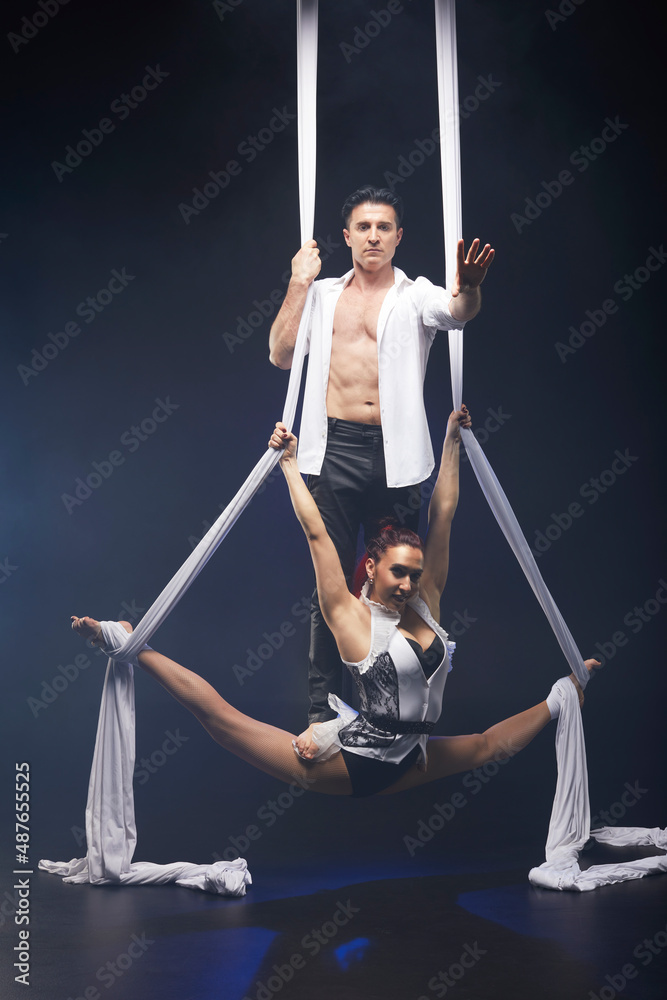 Circus performance arial, man and woman showing tricks. Stock Photo ...