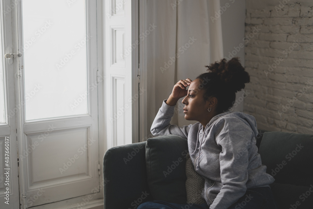 Young african american woman suffering from depression, anxiety and ...