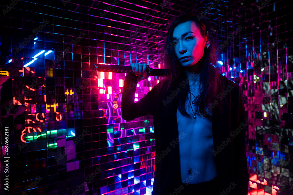 Male transgender neon light studio. Asian with samurai sword. Stock ...