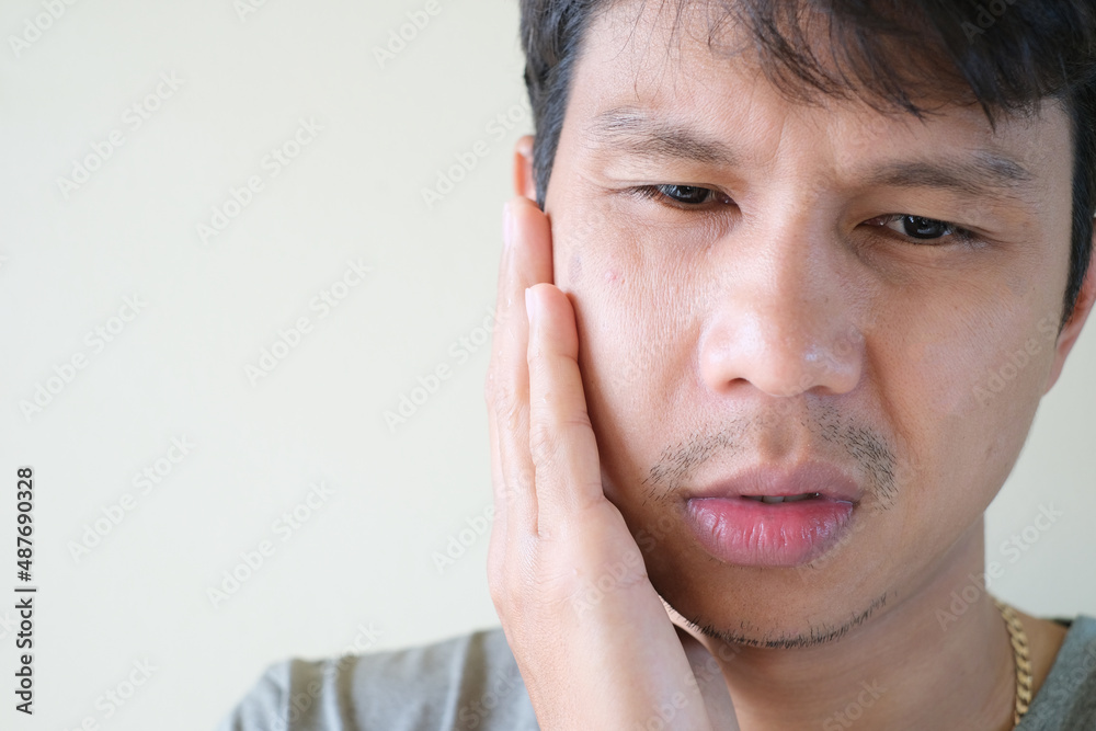 Teetch problem. Asian male with painful cheek swelling or dental ...