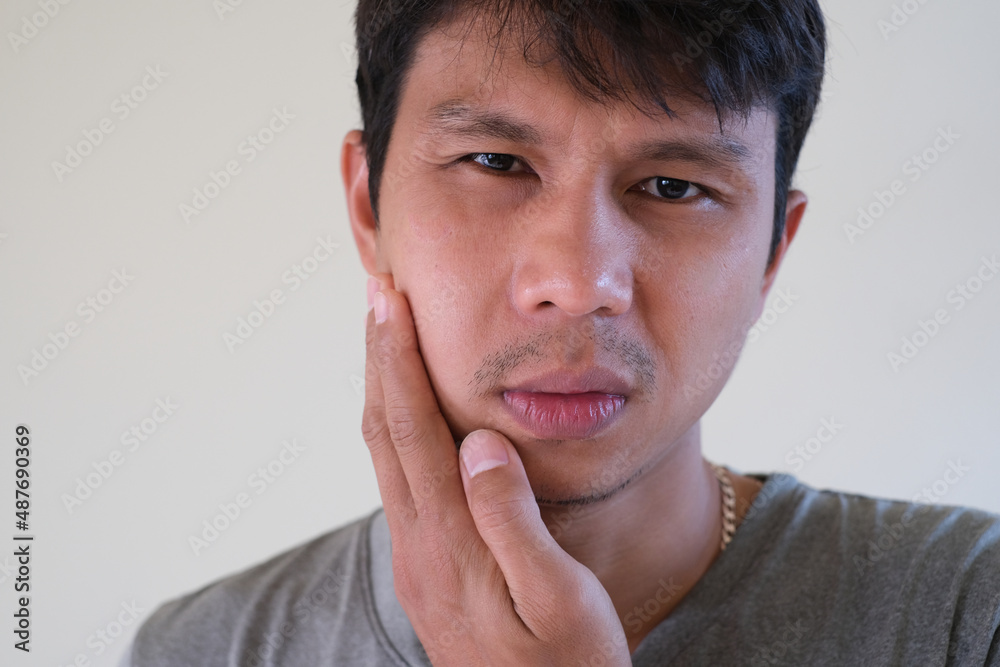 Teetch problem. Asian male with painful cheek swelling or dental ...