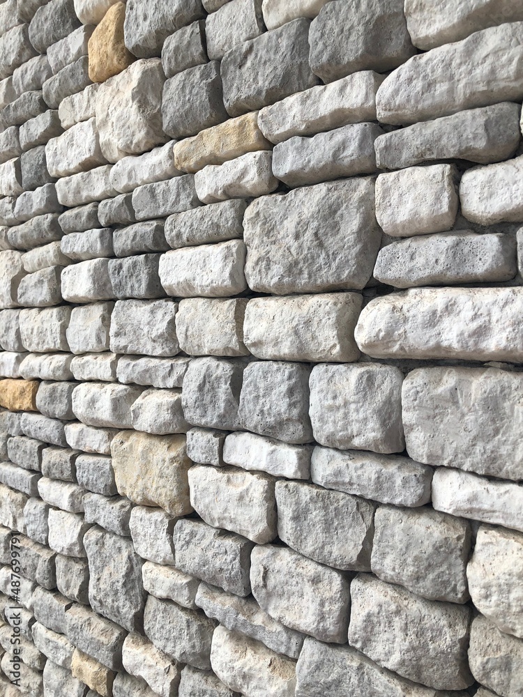 Perspective view of decorative natural cobble stone wall with different ...